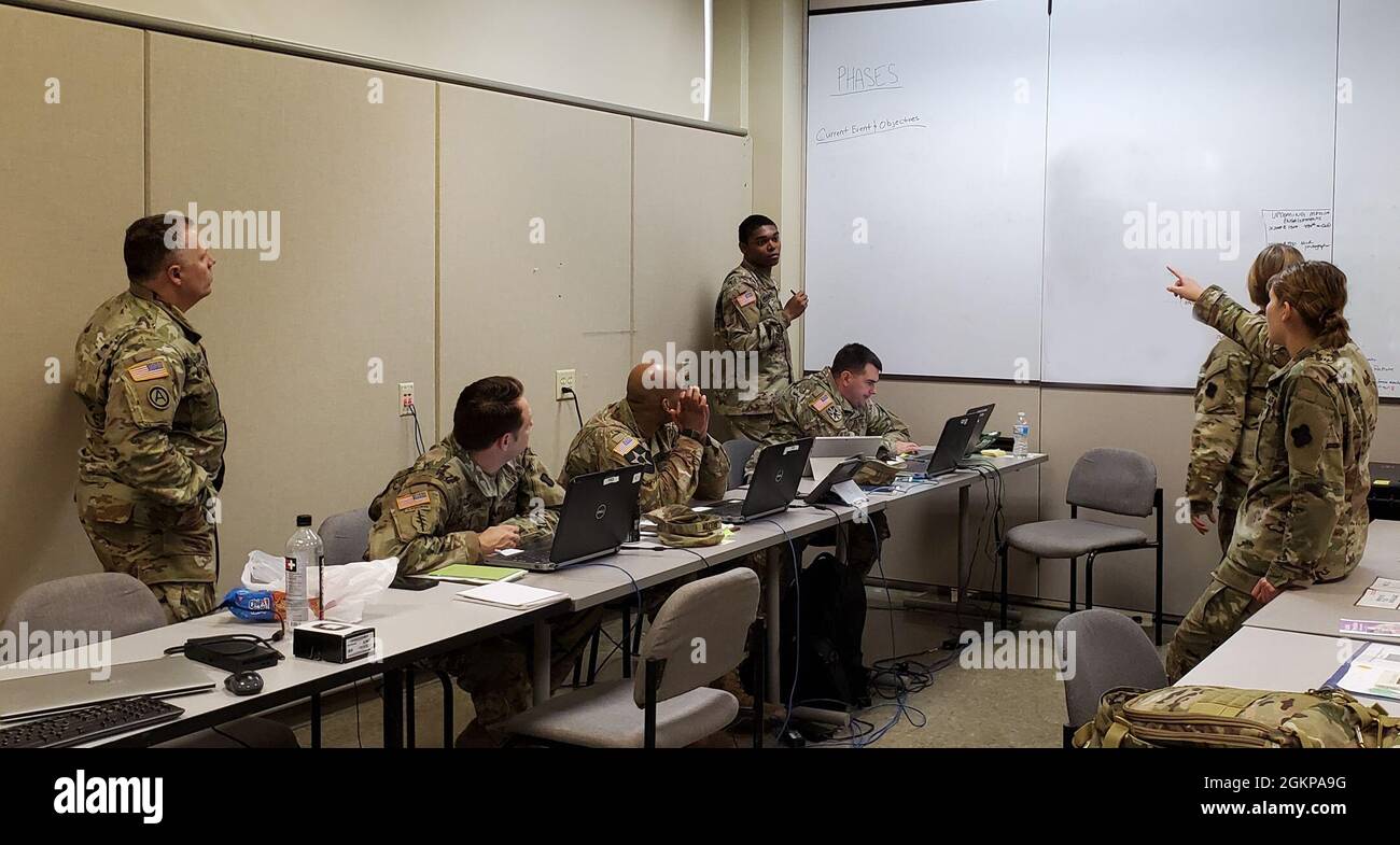 Members of the 318th Theater Public Affairs Support Element work ...