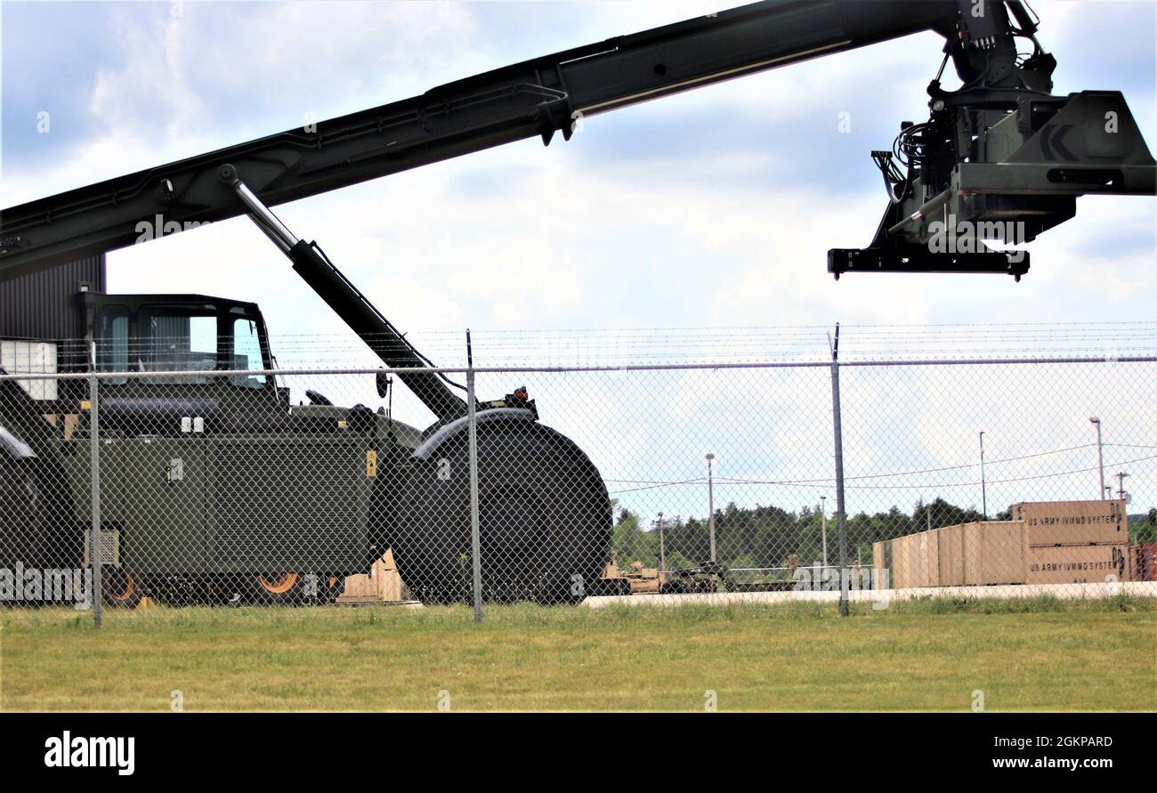 An Army Standard 50,000-pound-capable Rough Terrain Container Handler ...