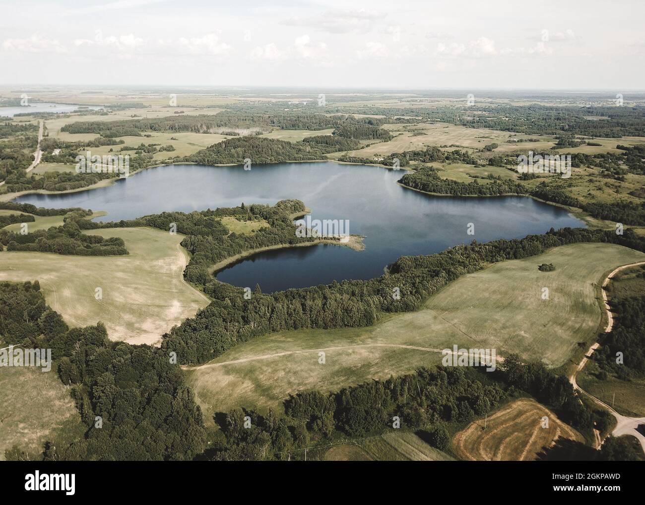 Aerial view of lake and fields Stock Photo - Alamy