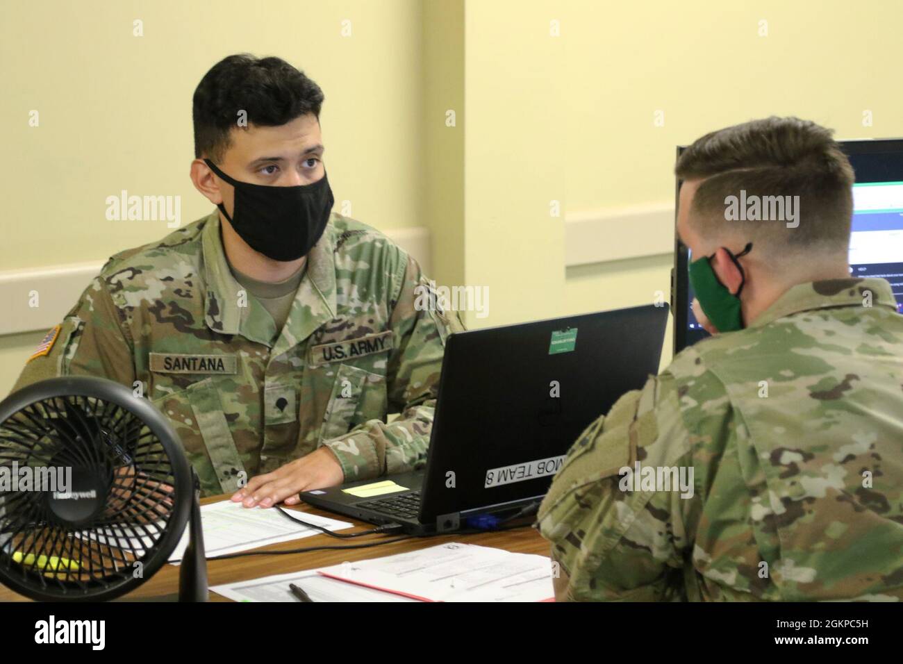 U.S. Army Spc. Jace Santana (left), a personnel manager for the 143rd ...