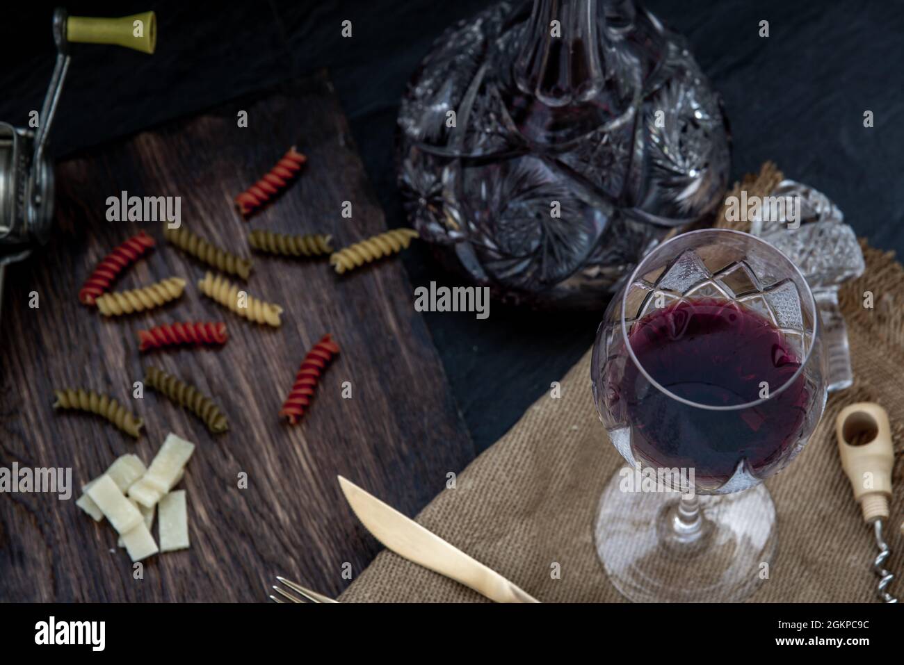 Flat lay composition with pitcher and glasses of red wine and corkscrew ...