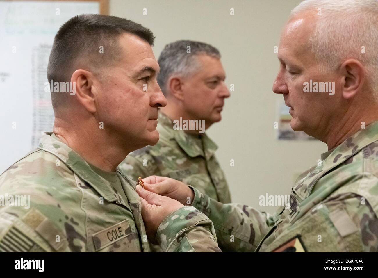 Lt. Gen. Jon A. Jensen, Director, Army National Guard, pins the ...