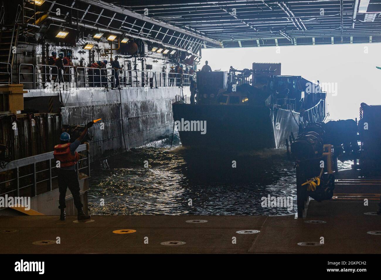 U.S. Marines and Navy Sailors aboard the amphibious assault ship USS ...