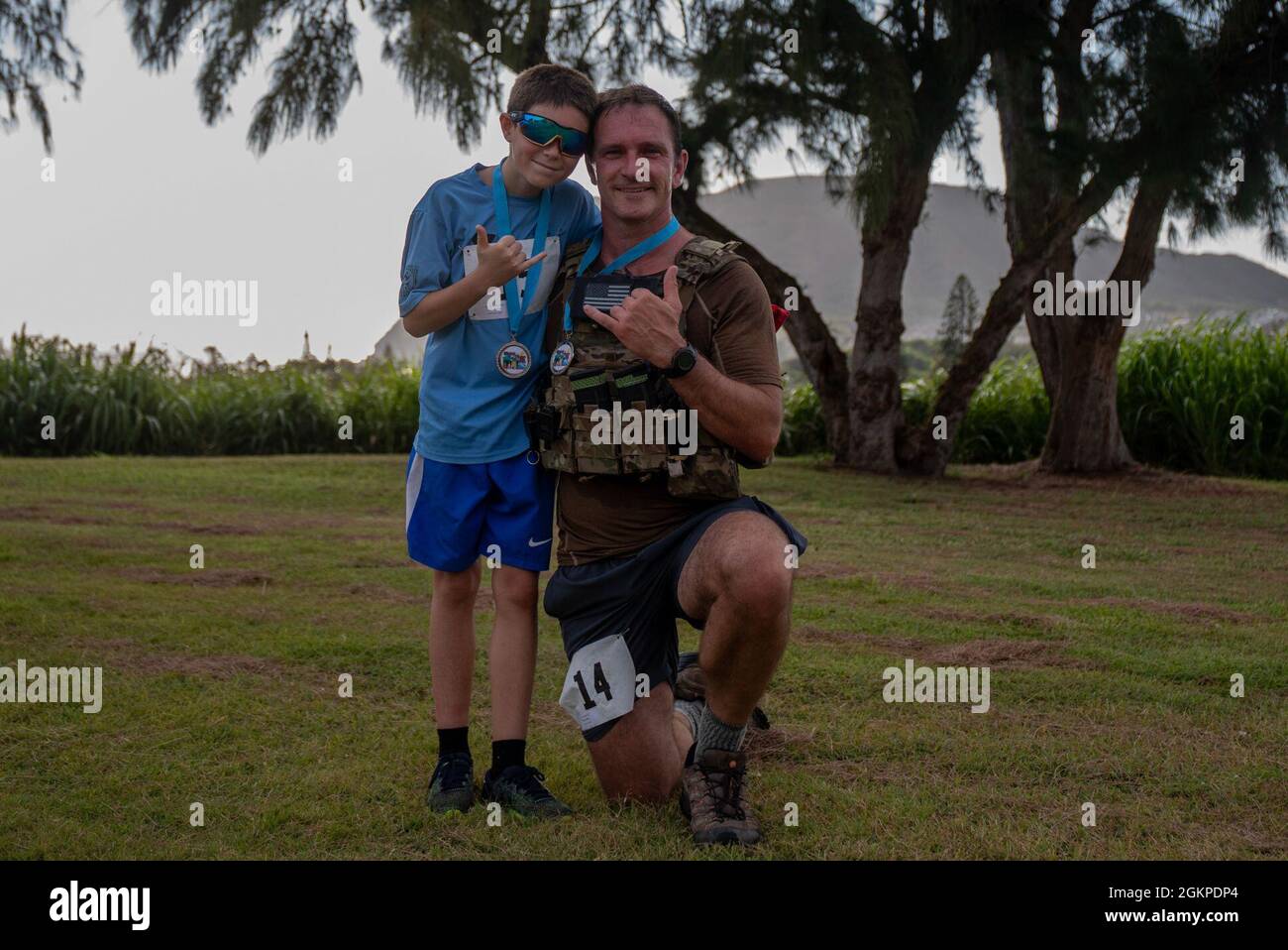 U.S. Air Force Lt. Col. and his son, receive their medals for finishing ...