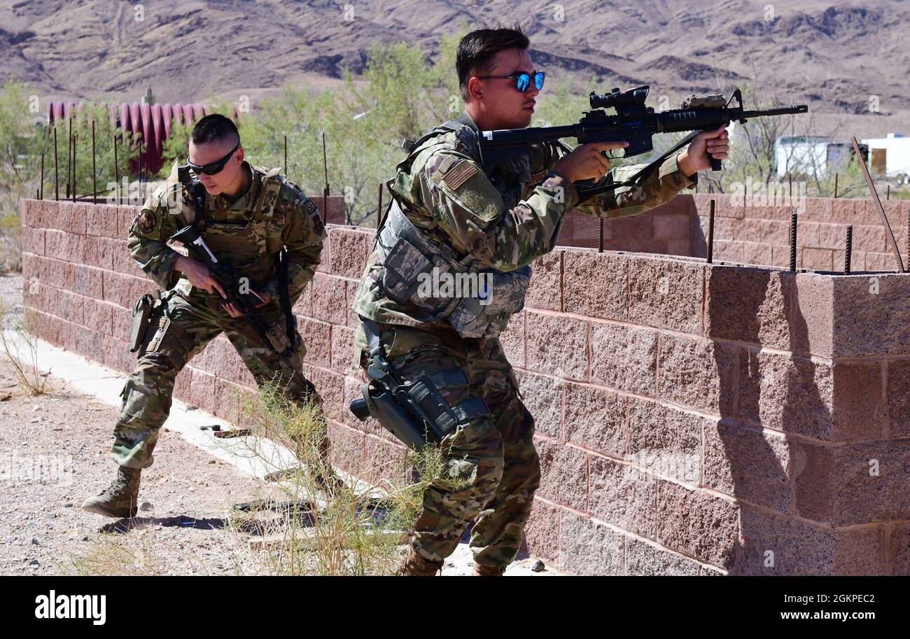 Members of the 926th Security Forces Squadron take turns aiming and ...