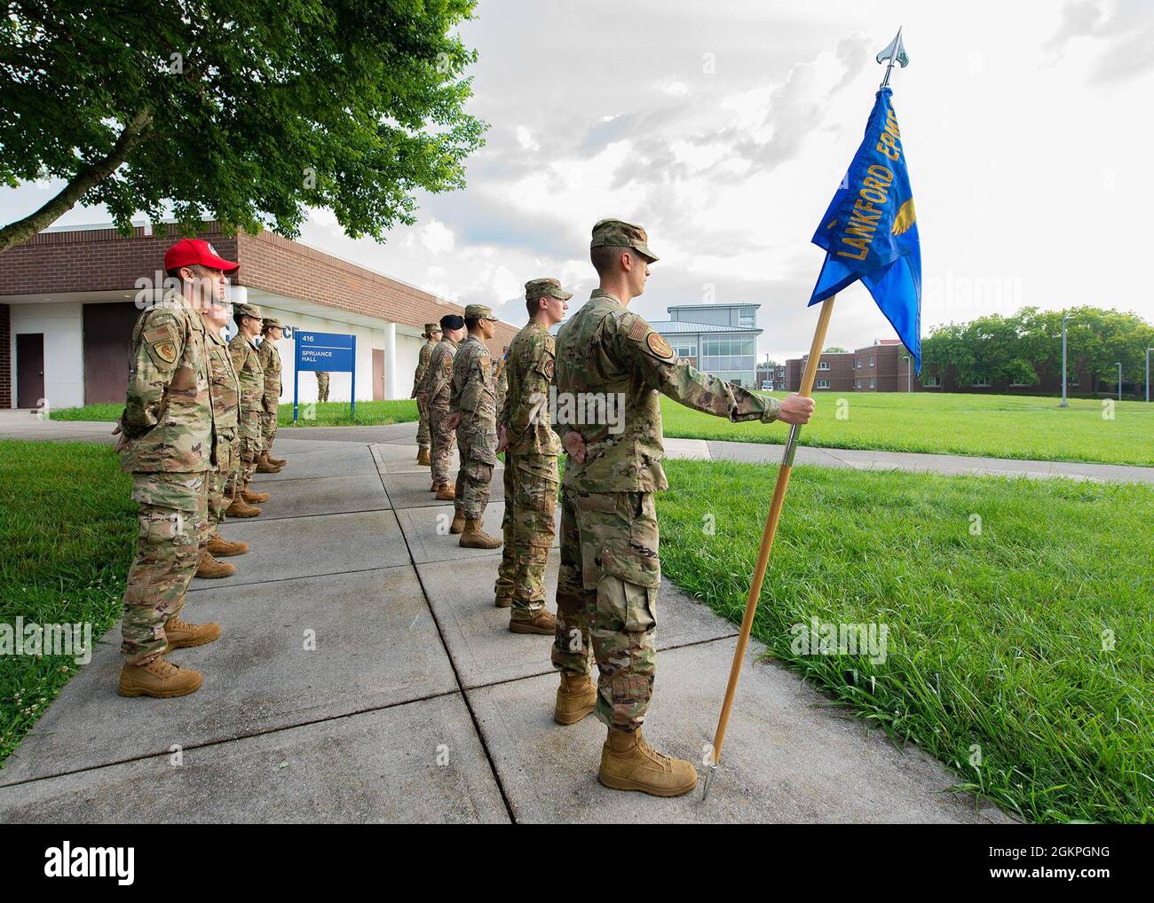 U.S. Air Force Airmen enrolled in Airman Leadership School raise the ...