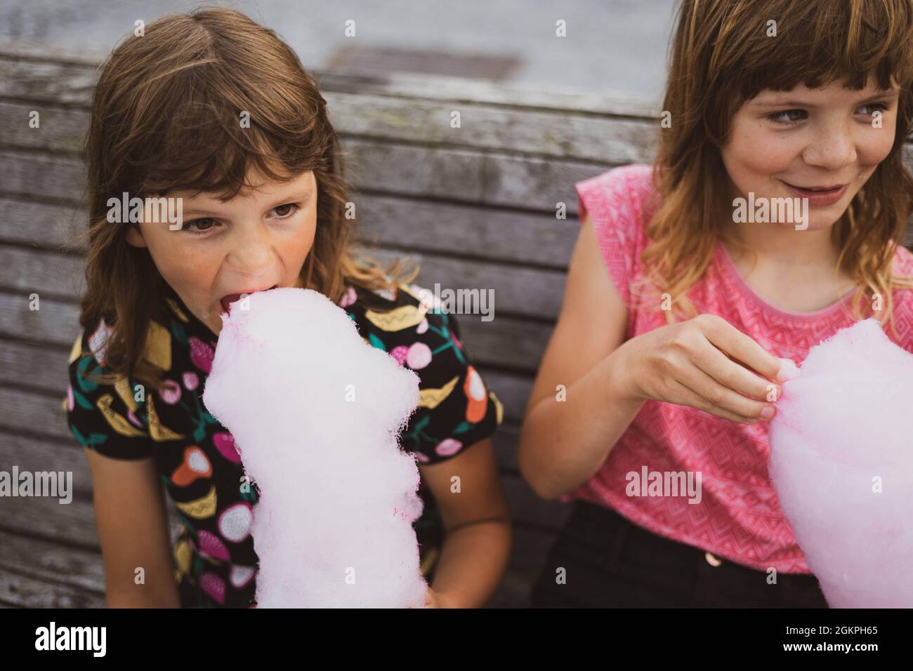 Children having fun with cotton candy Stock Photo - Alamy
