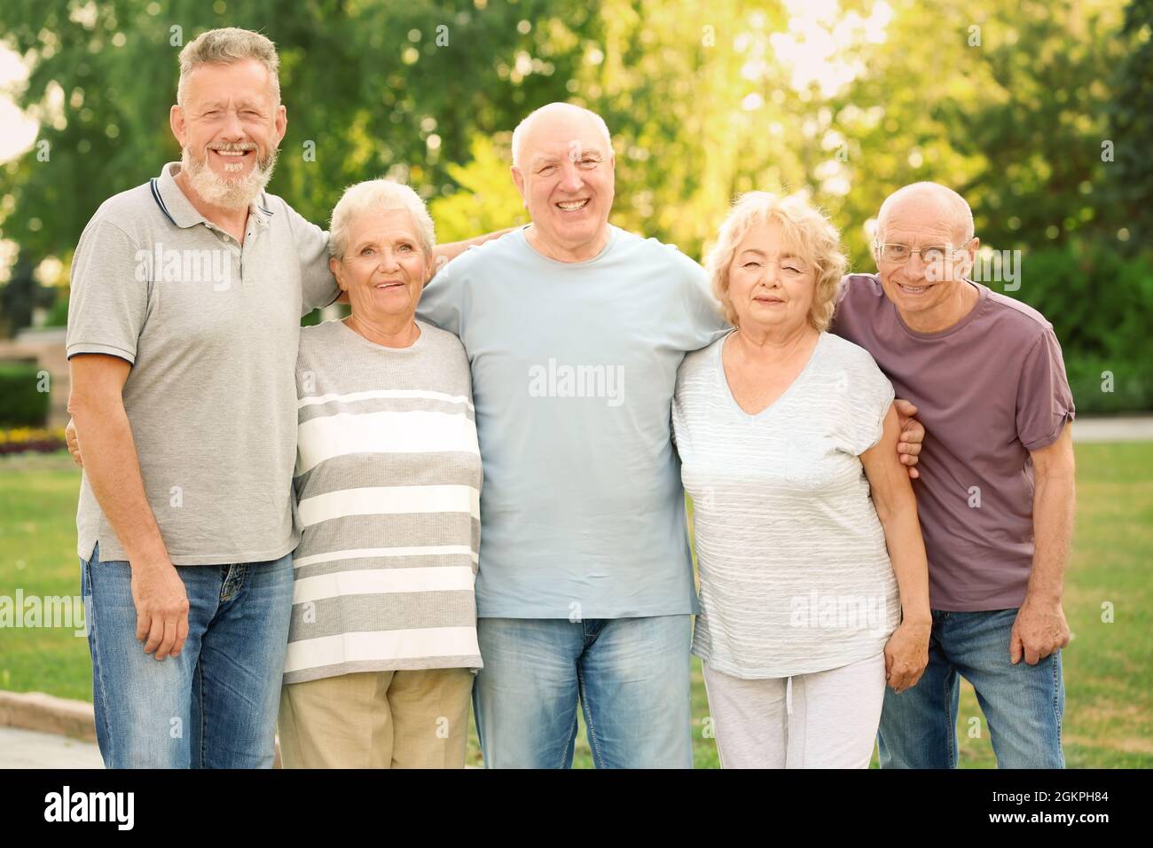 Group of elderly people resting in park Stock Photo - Alamy