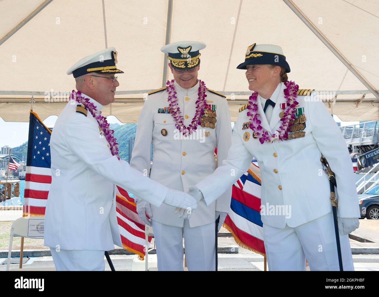 Capt. Thomas D’Arcy (left) relieves Capt. Holly Harrison (right) while ...