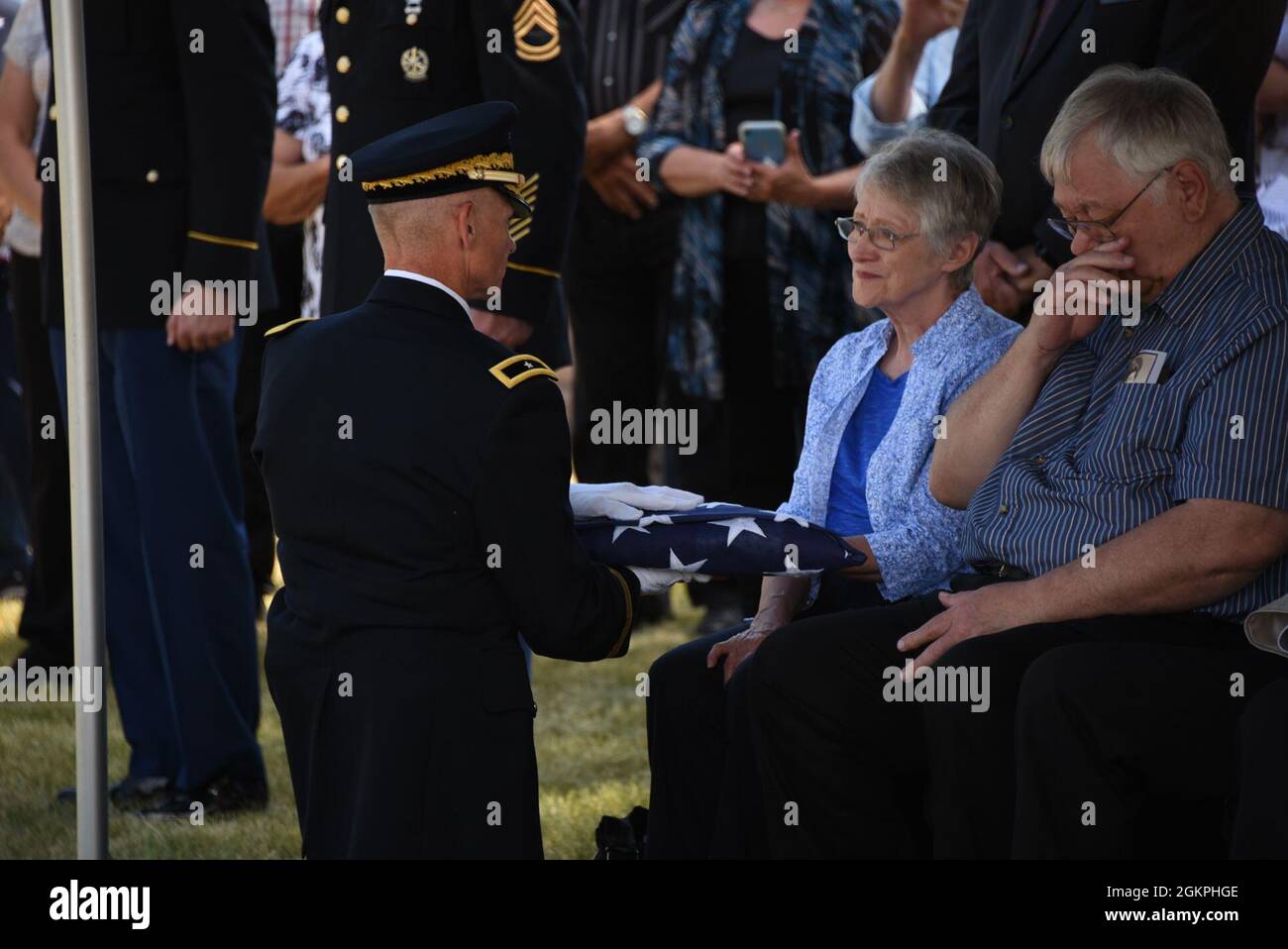Brig. Gen. Stephen Osborn of the Iowa National Guard presents a U.S ...