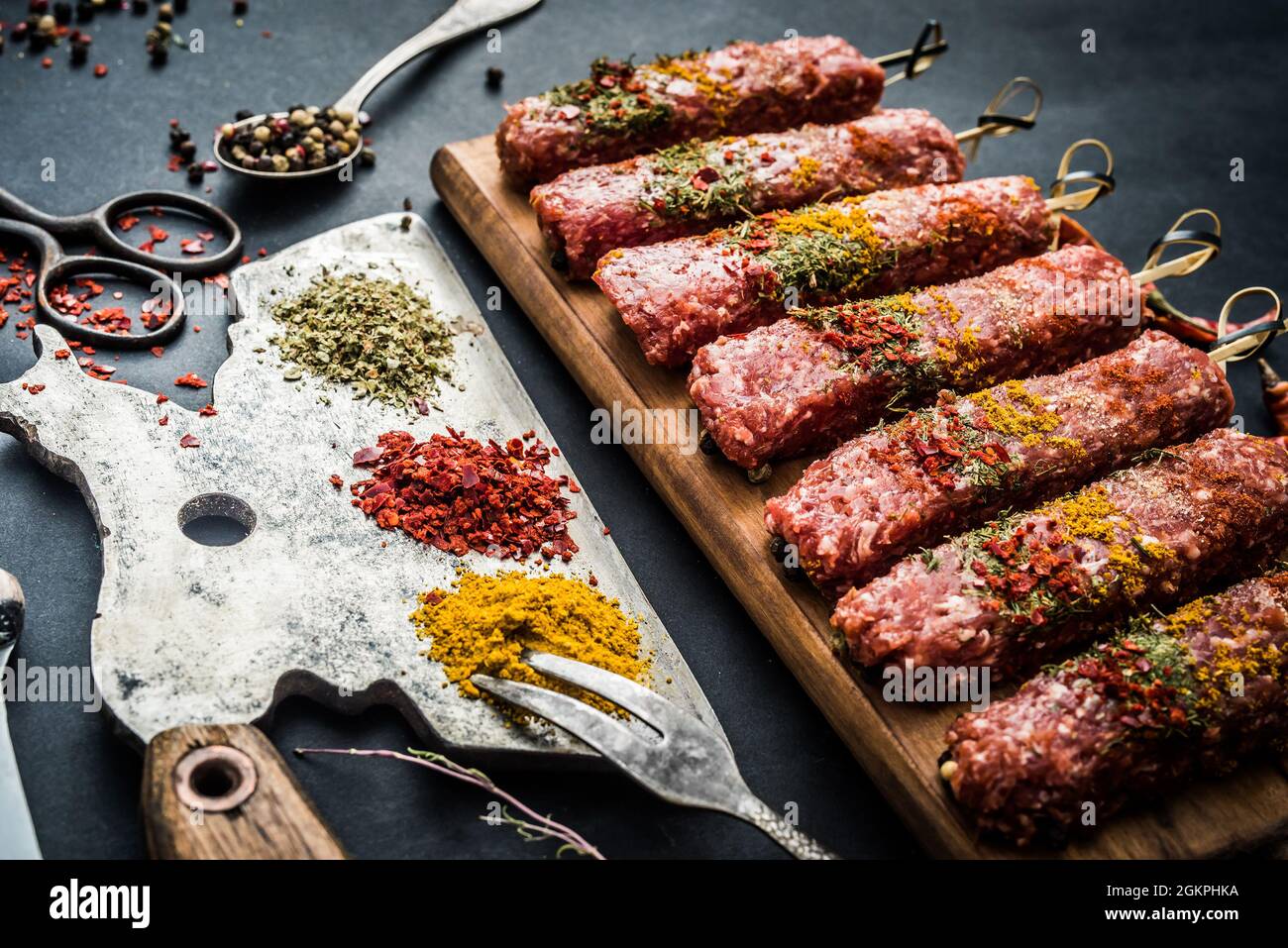 Raw kebab with spices Stock Photo - Alamy