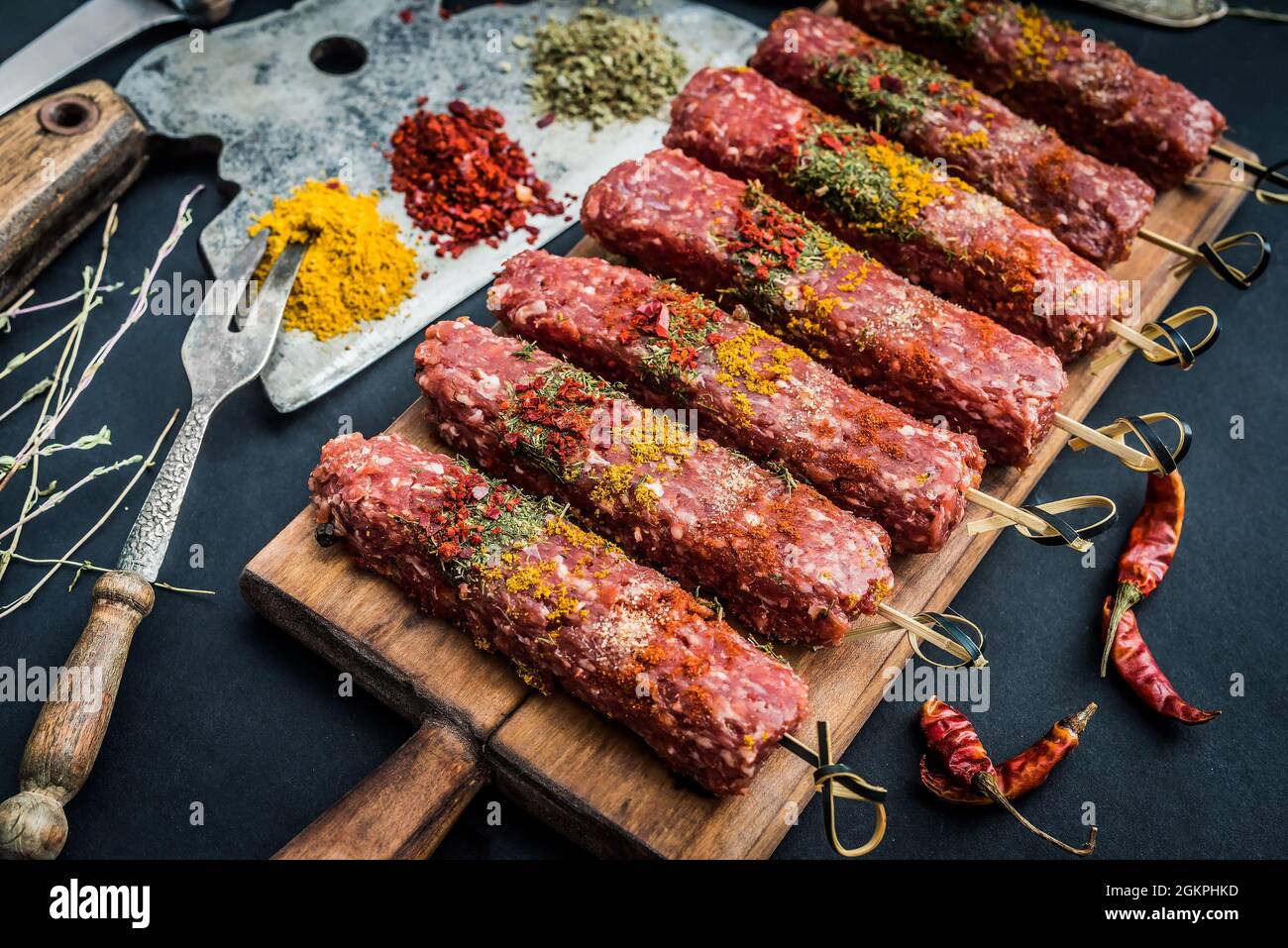 Raw kebab with spices Stock Photo - Alamy