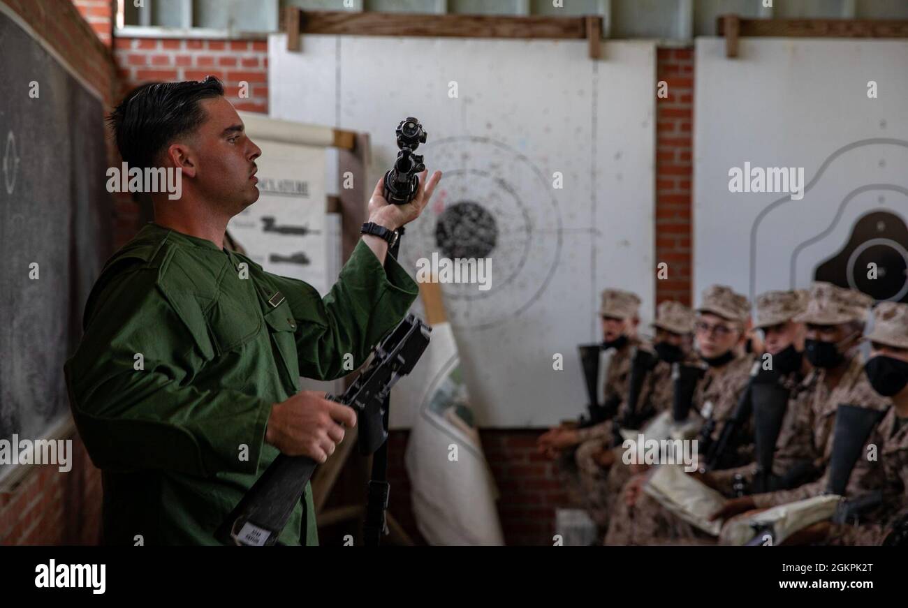 Sgt. Chase R. Day, a Primary Marksmanship Instructor with Weapons and ...