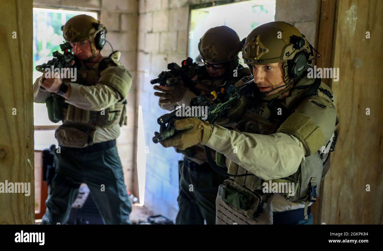 U.S. Marines with the Special Response Team (SRT) and police officers ...
