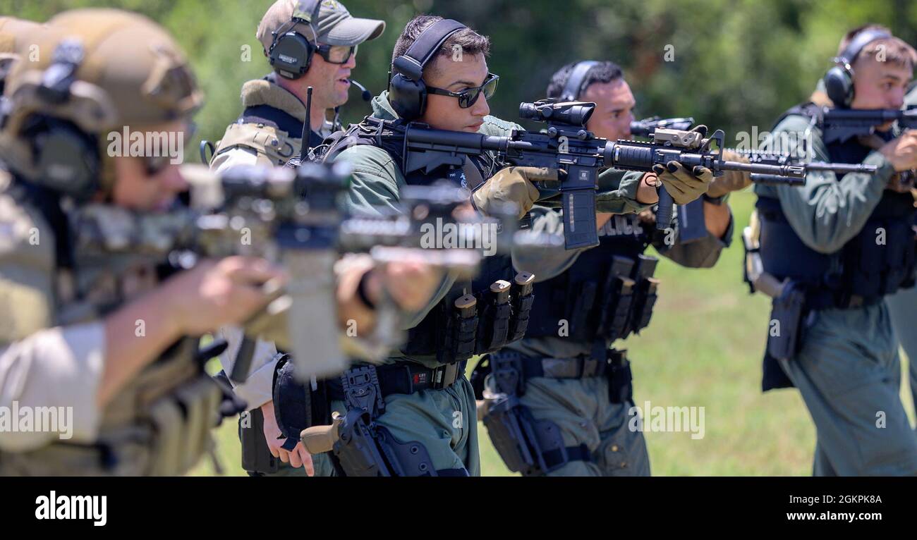 U.S. Marines with the Special Response Team (SRT) and police officers ...