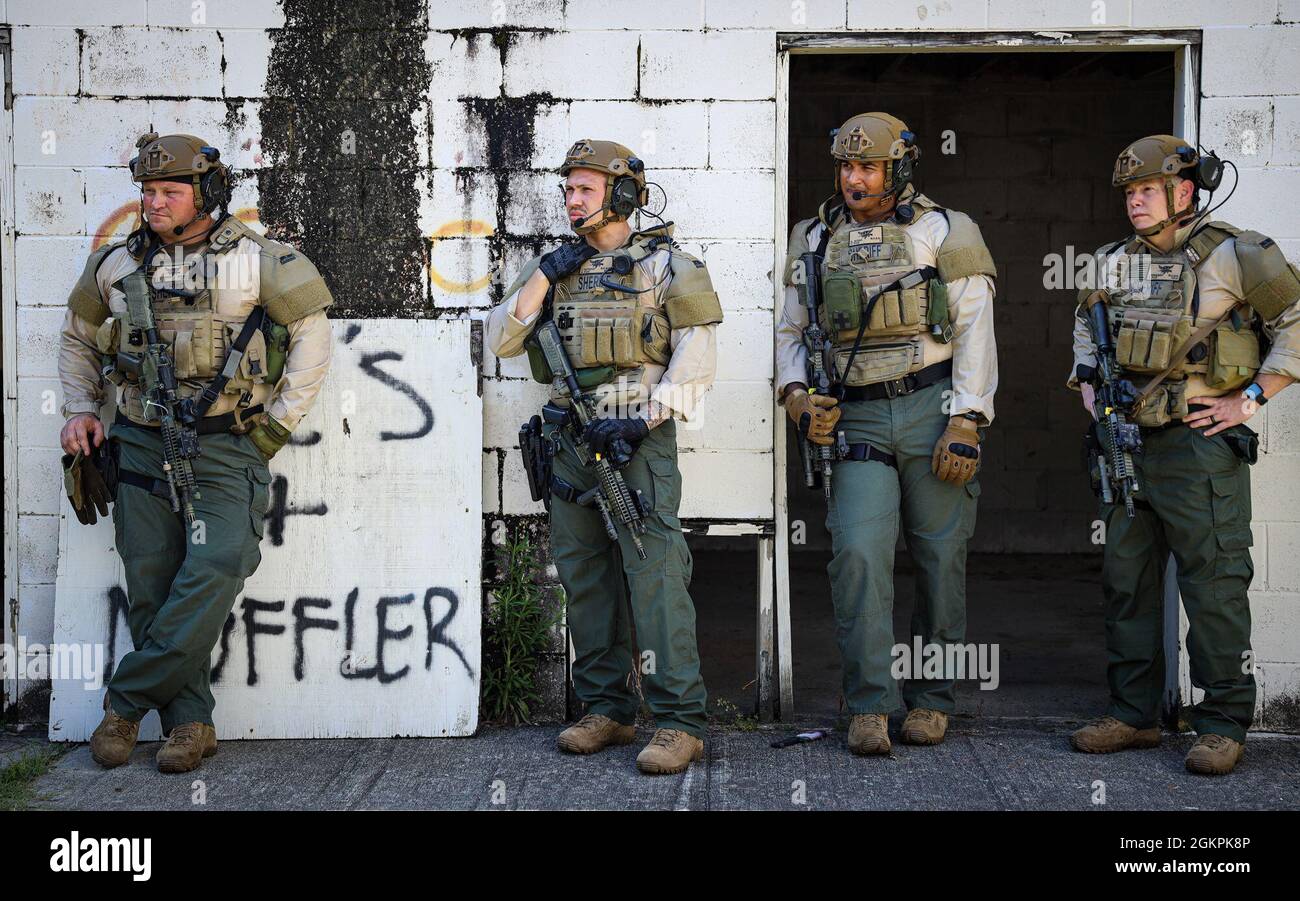 U.S. Marines with the Special Response Team (SRT) and police officers ...