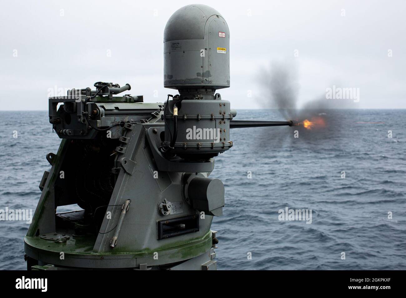 PACIFIC OCEAN (June 14, 2021) A Mark 38 machine gun fires during an ...