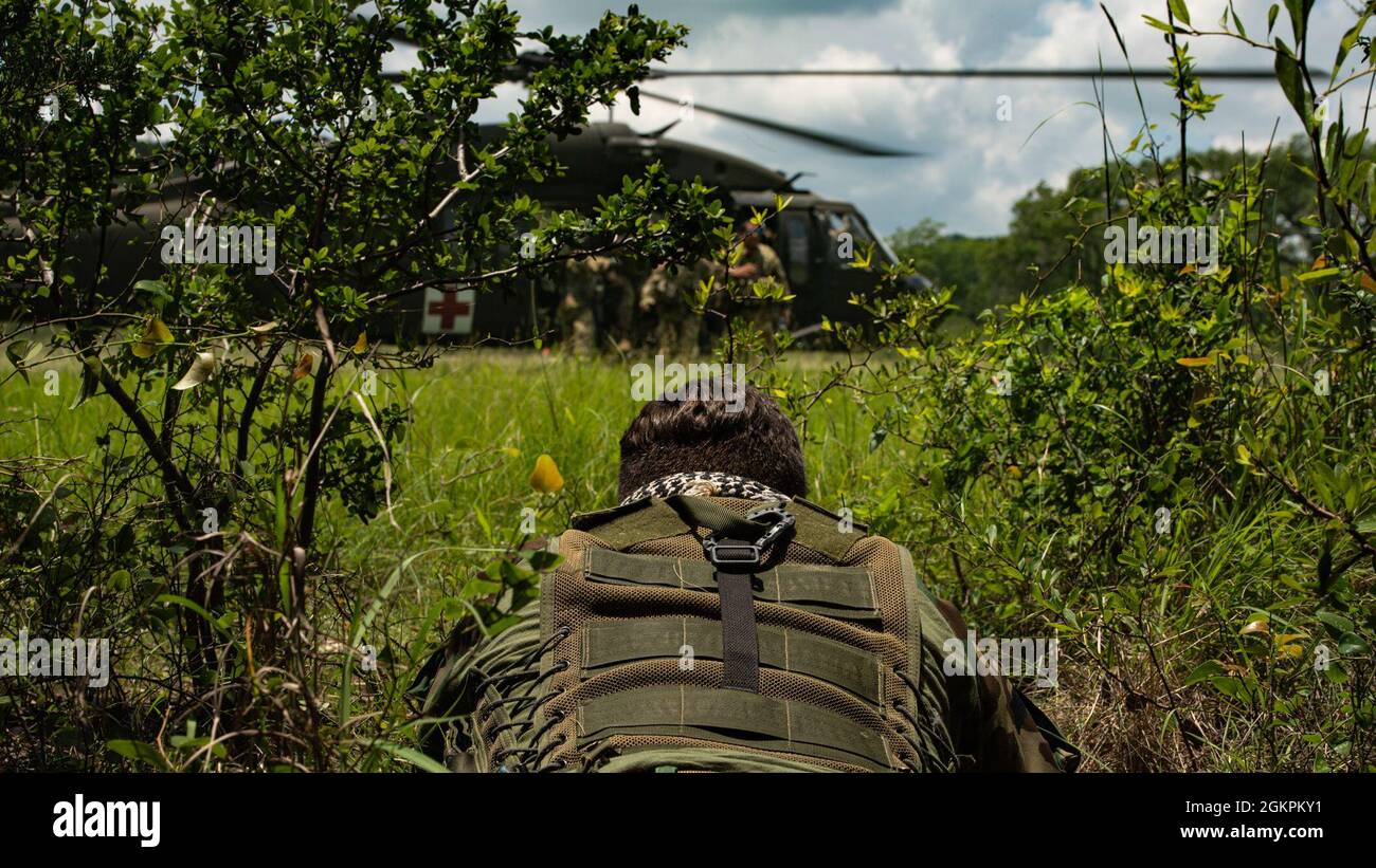 A U.S. Air Force training instructor acting as enemy forces prepares to ...