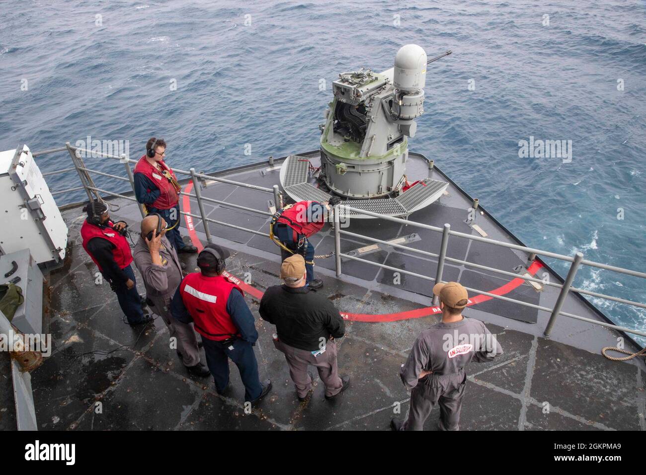 PACIFIC OCEAN (June 14, 2021) Sailors prepare a Mark 38 machine gun ...