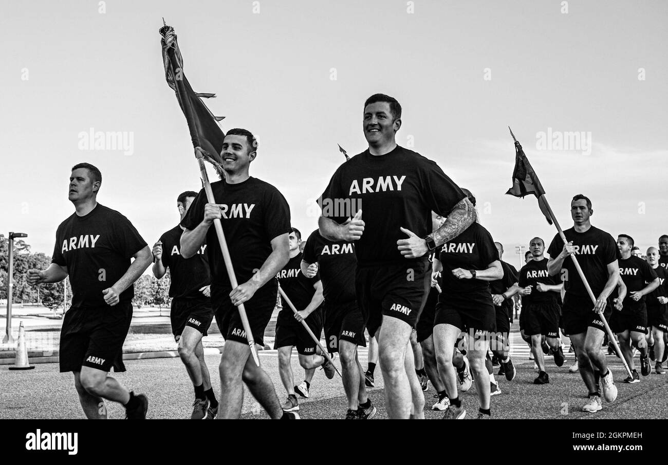 U.S. Soldiers run in formation honoring the birthday of the Army at ...