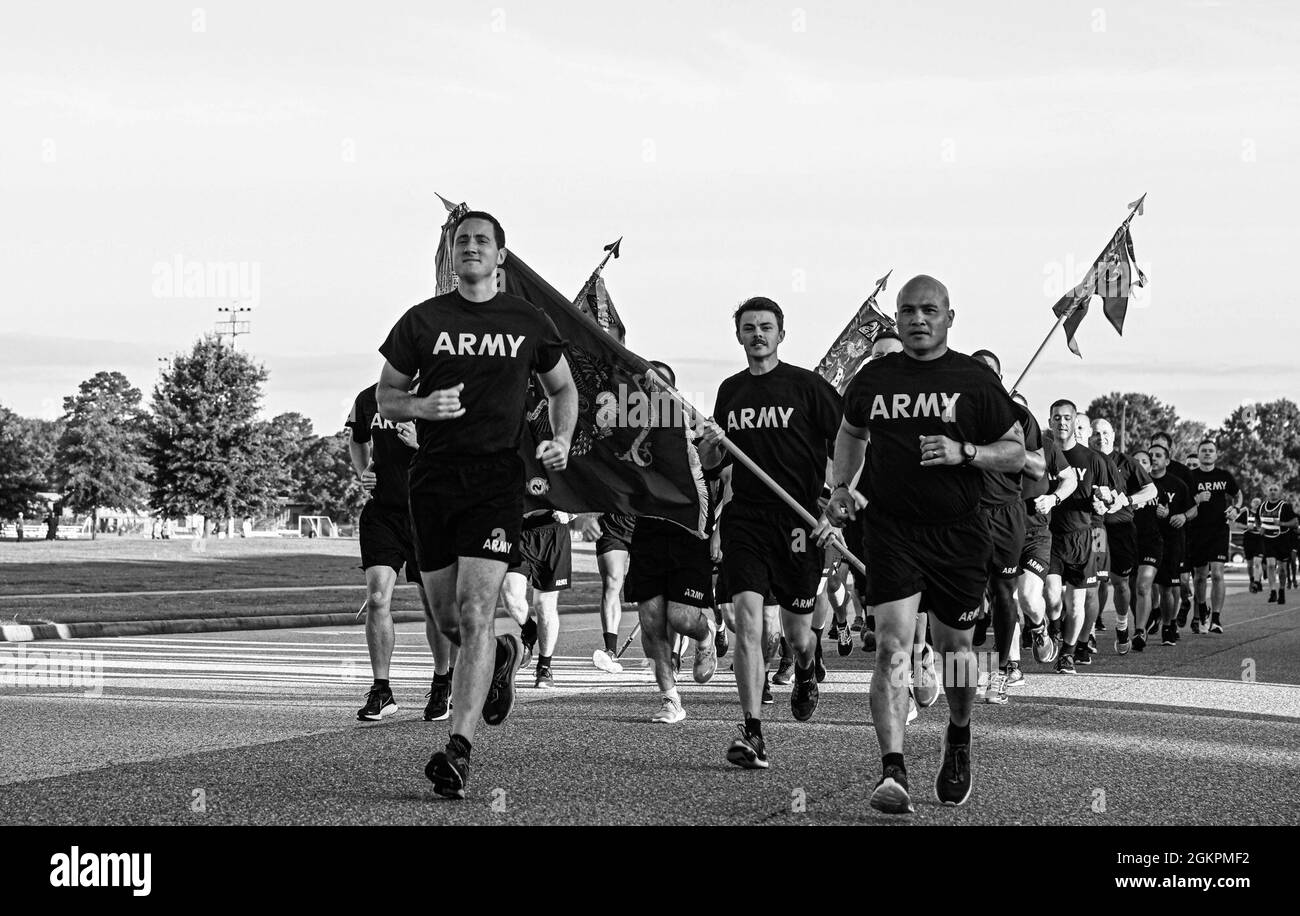 U.S. Soldiers run in formation honoring the birthday of the Army at ...