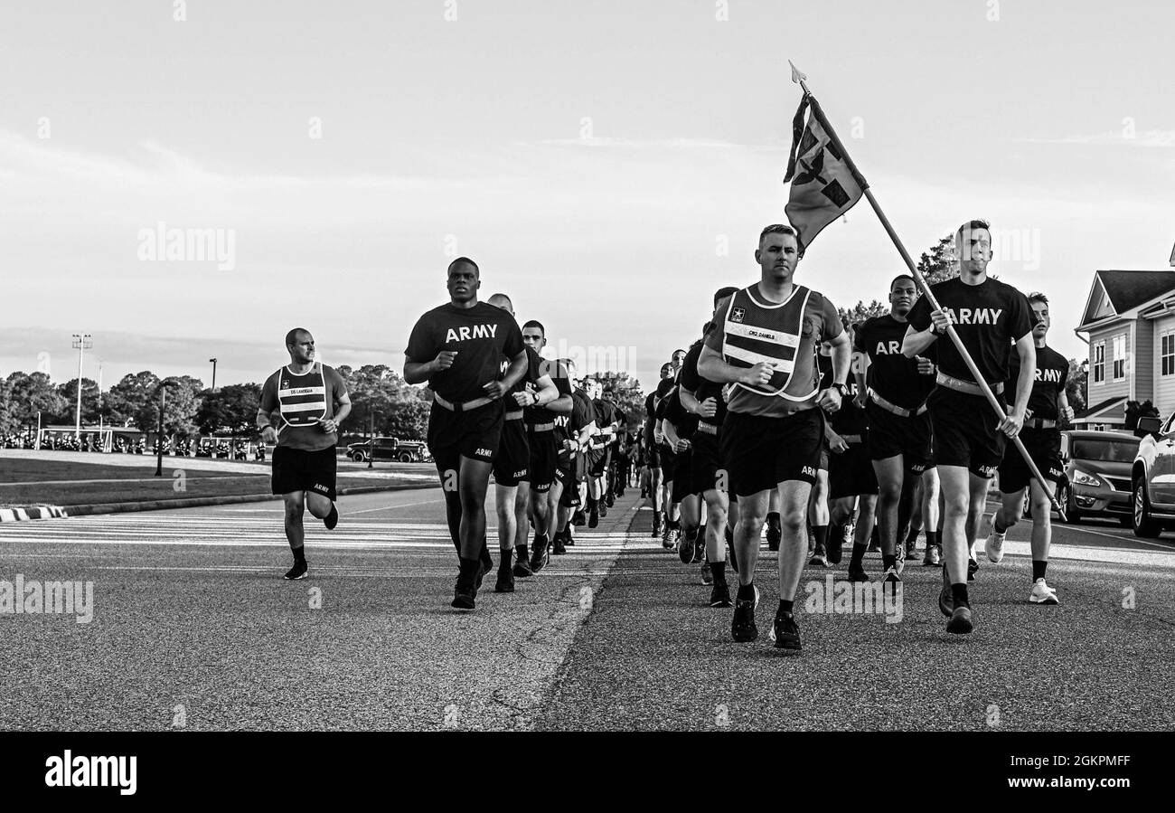 U.S. Soldiers run in formation honoring the birthday of the Army at ...