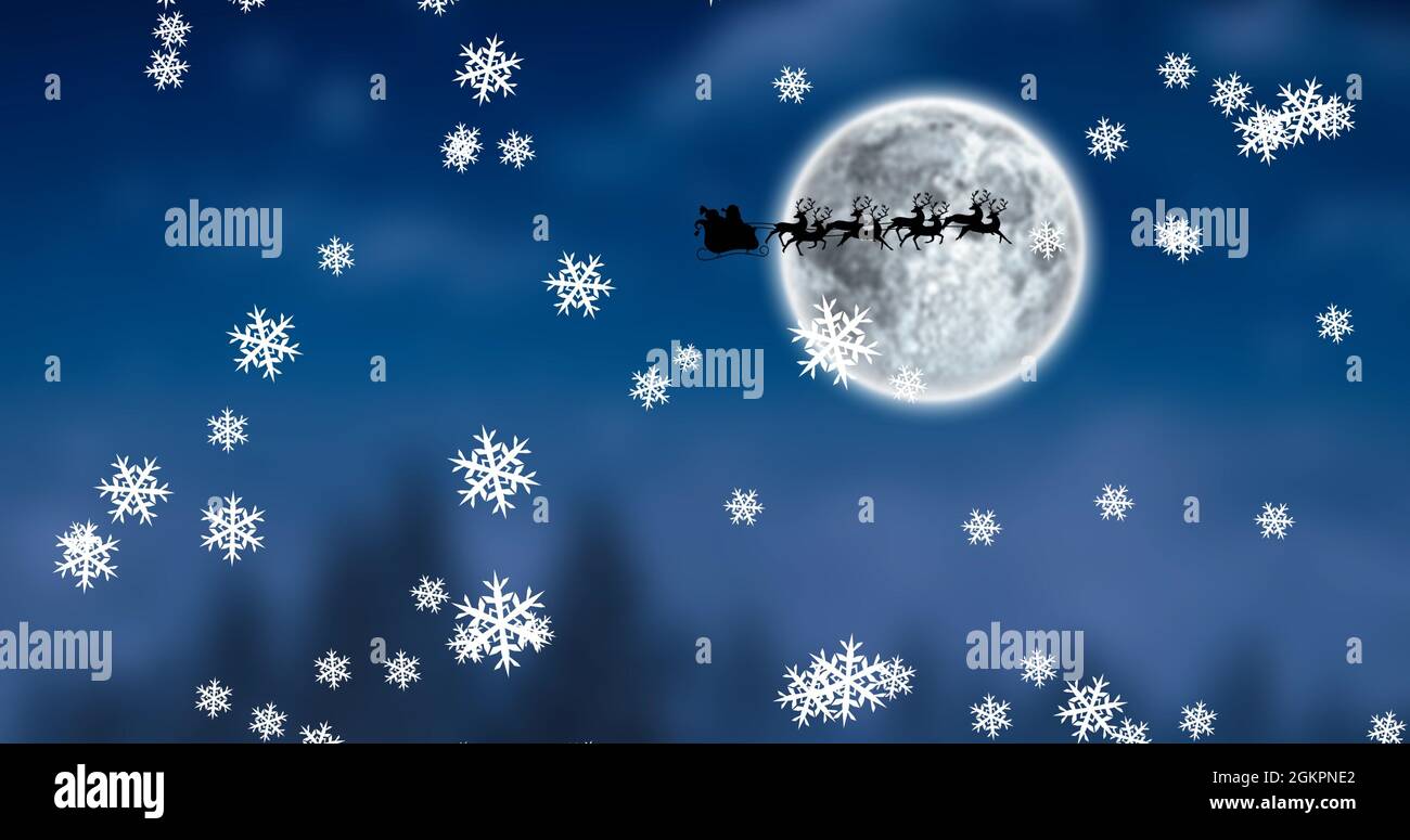 Image of winter scenery with snow falling and black silhouette of santa ...