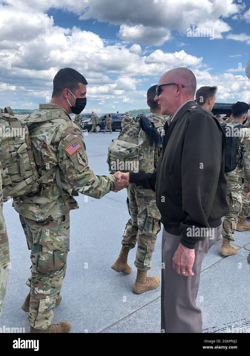 Maj. Gen. Mark Schindler, right, acting adjutant general of ...