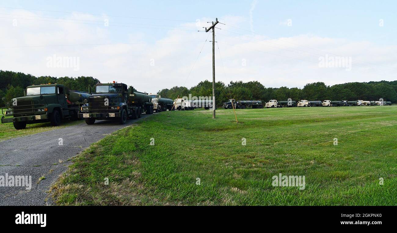 Army fuel trucks await being loaded with fuel as part of the annual ...