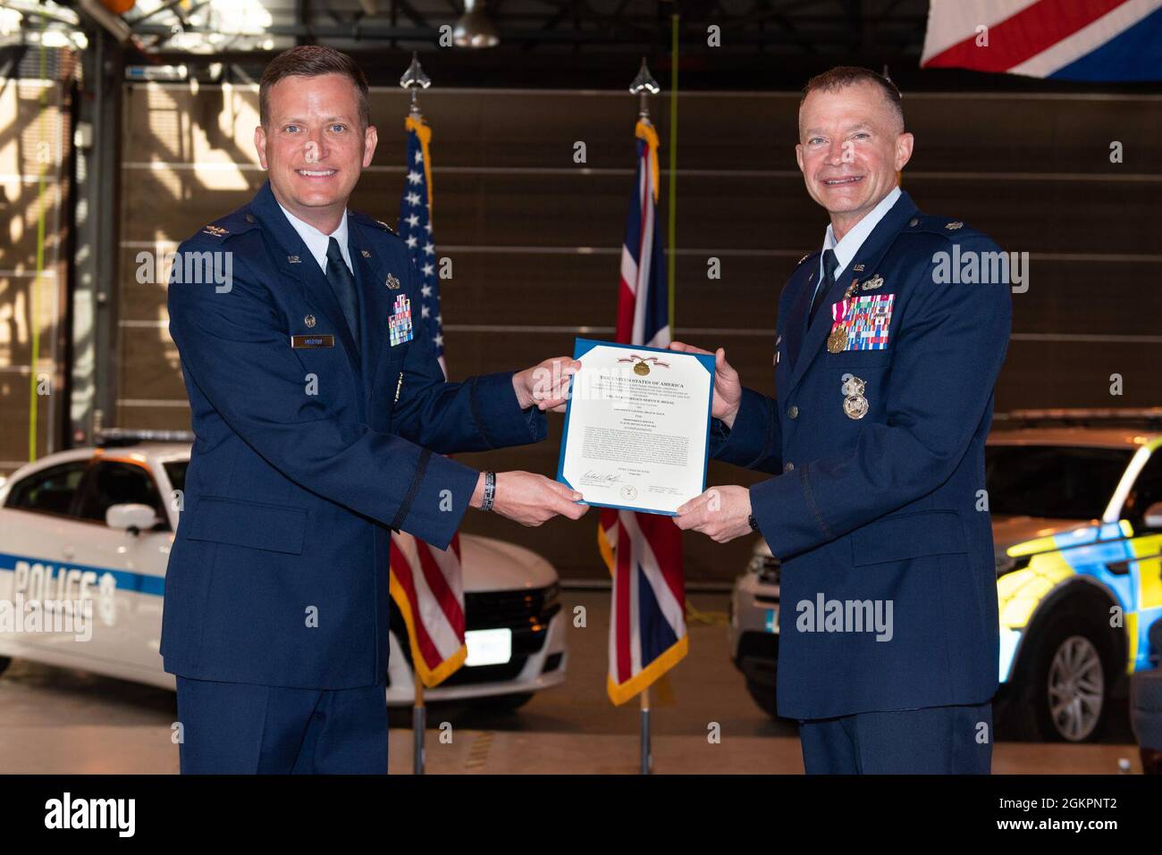 U.S. Air Force Lt. Col. Brian Mack, right, 423rd Security Forces Squadron outgoing commander ...