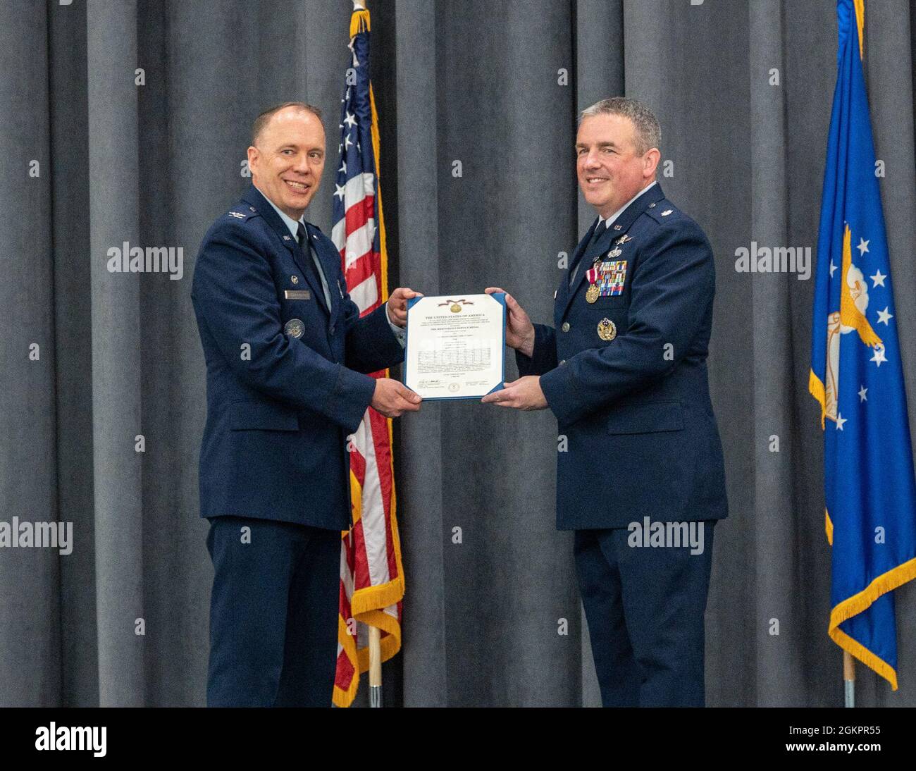 Lt. Col. Todd Caskey, right, outgoing 2nd Communications Squadron ...