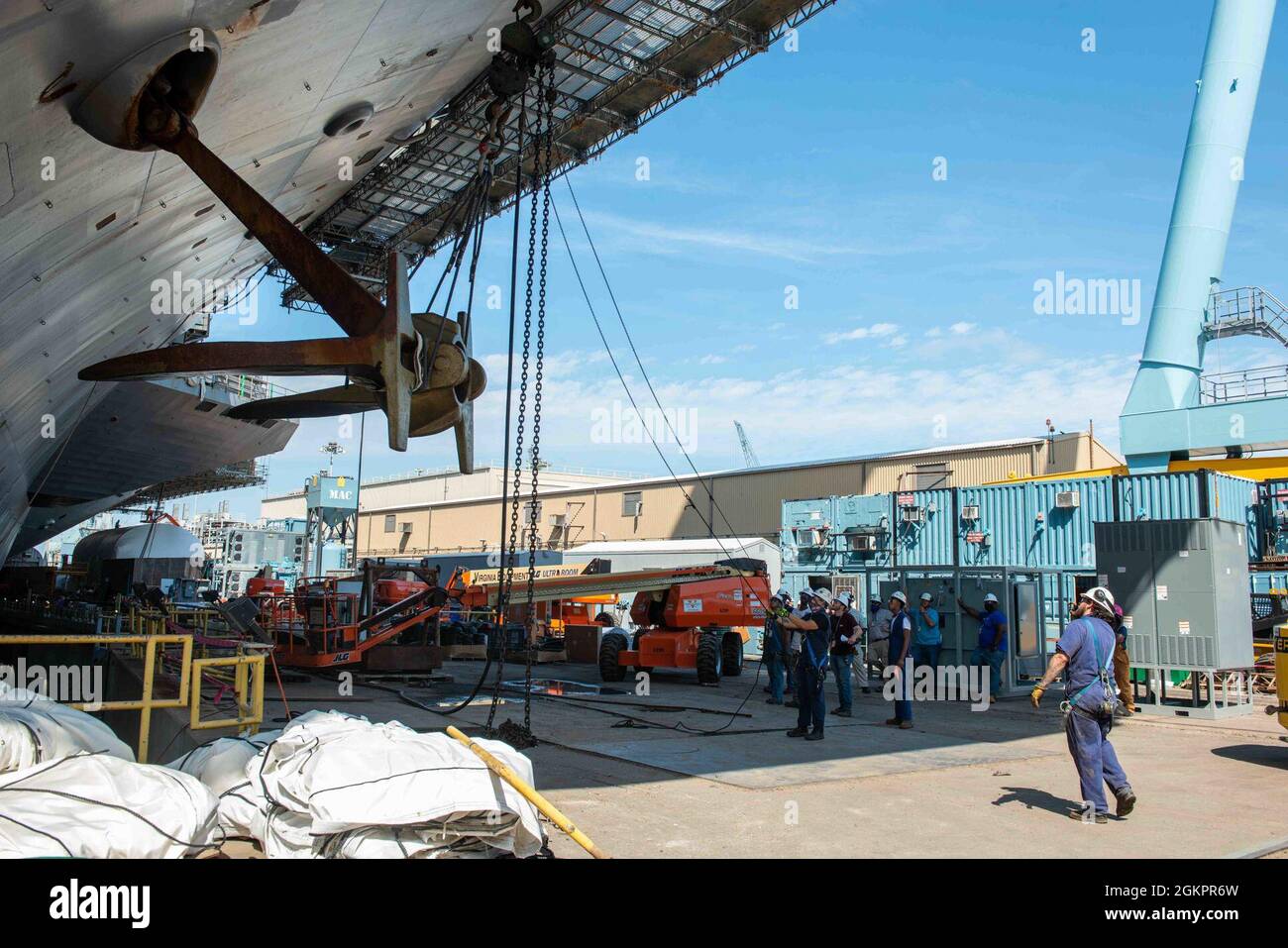 Newport News Shipbuilding contractors remove the port side anchor from ...