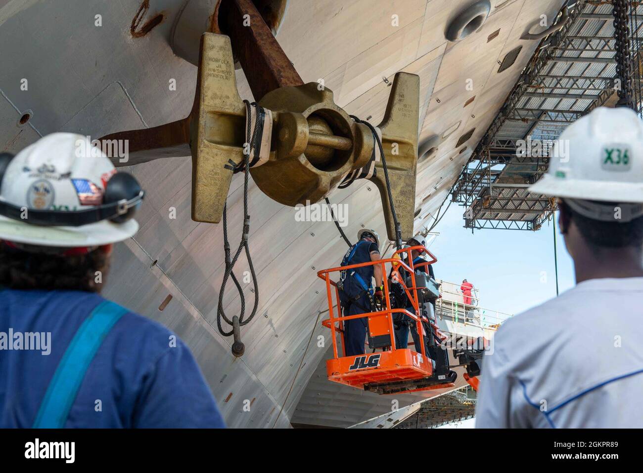 Newport News Shipbuilding contractors prepare to remove the port side ...