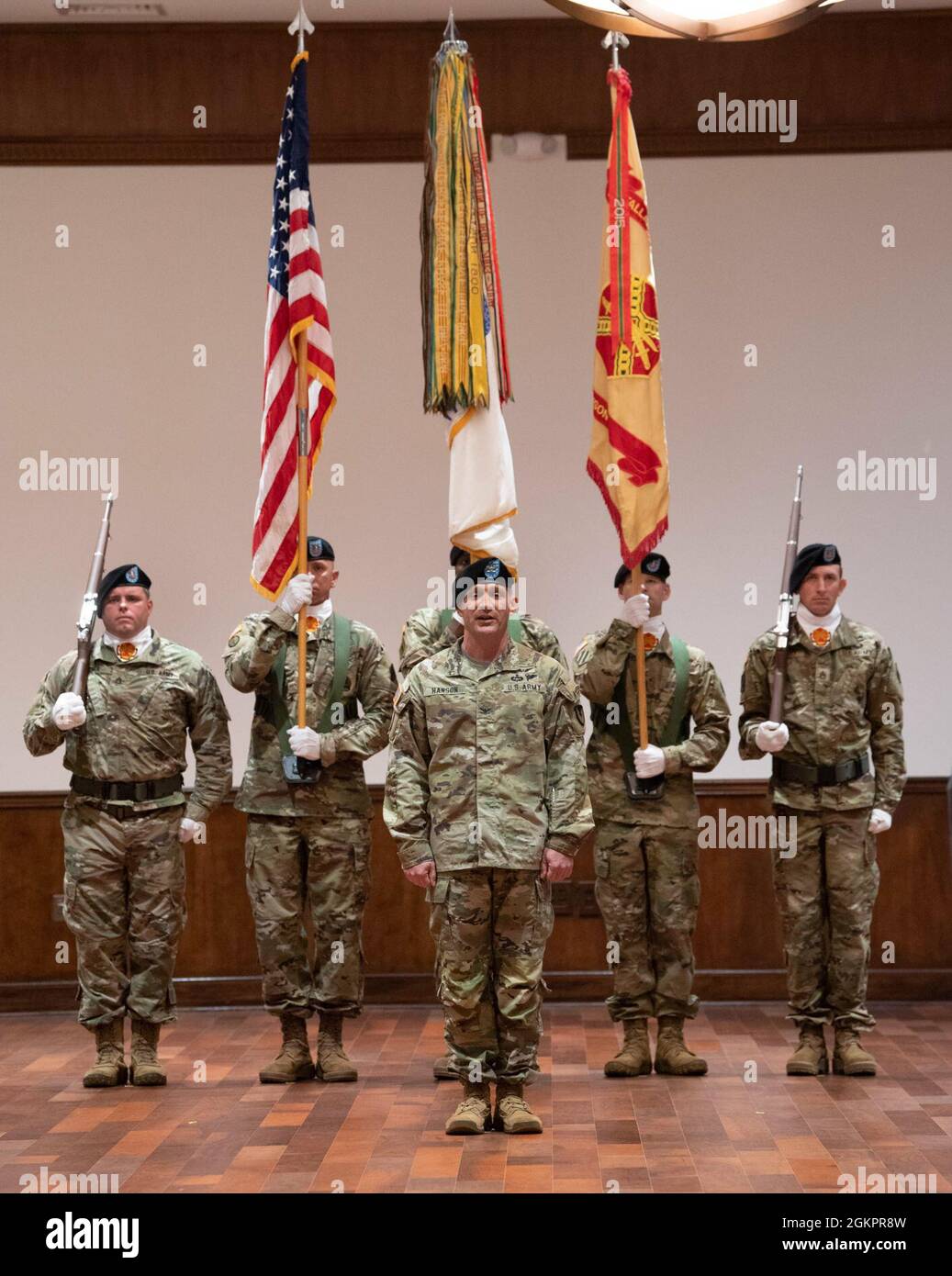 Col. Ryan Hanson, garrison commander, sings the Army Song after taking ...