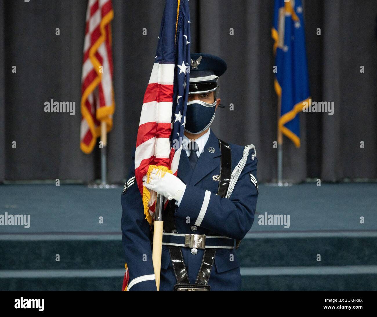 A Member of the Barksdale Honor Guard presents the colors at a change ...