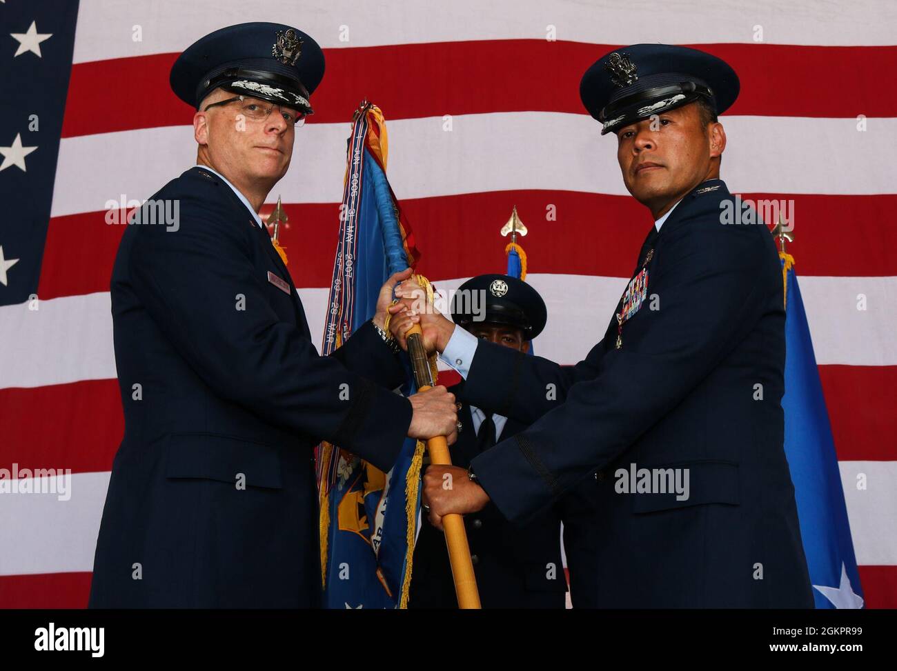 Col. Ed Sumangil, former 7th Bomb Wing commander, right, passes an ...