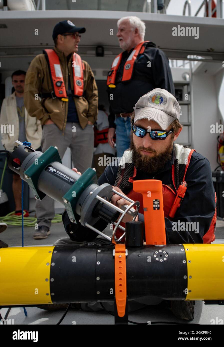 Joseph Grinnan, a maritime archeologist assigned to SEARCH, performs ...