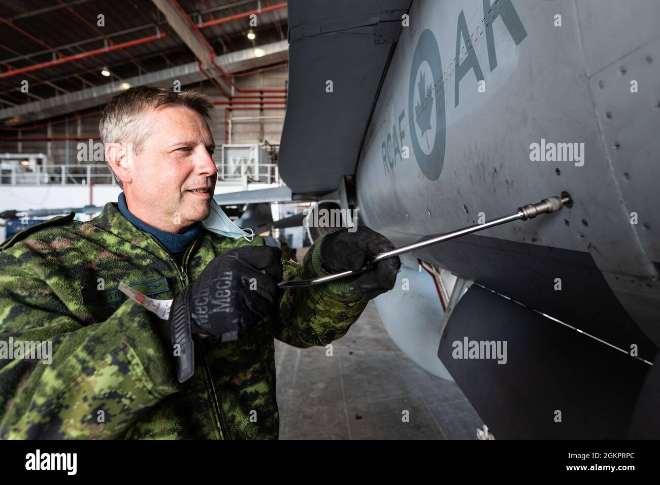 Royal Canadian Air Force aircraft maintenance technician carries out ...