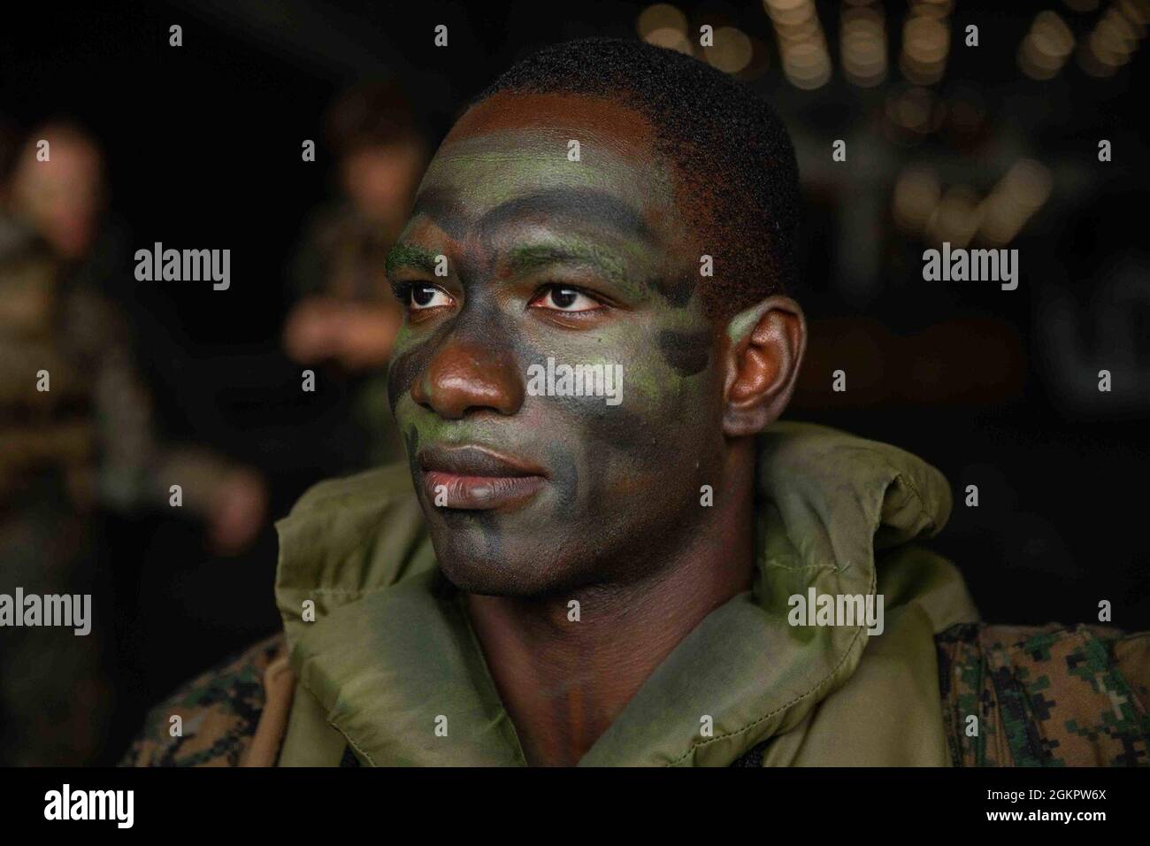 U.S. Marine Corps Lance Cpl. Victor Obakpe, a small craft mechanic ...