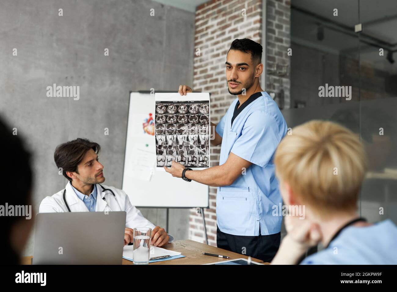 Middle-eastern doctor showing his colleagues MRI scan Stock Photo - Alamy