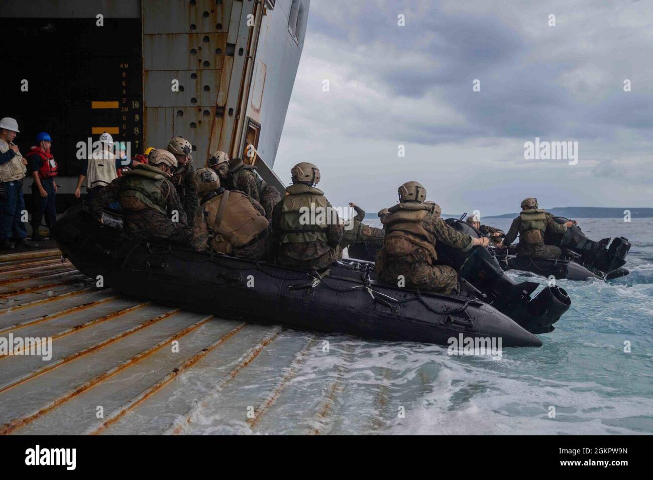 U.S. Marines and Navy Sailors aboard the amphibious assault ship USS ...
