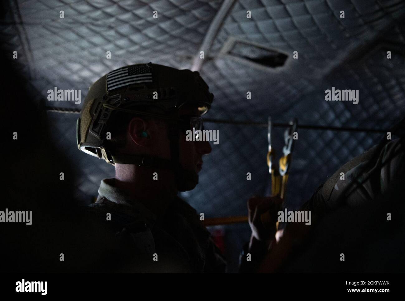 An Airman from the 820th Base Defense Group prepares his static line to ...