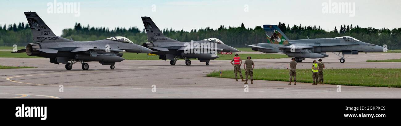 A Royal Canadian Air Force CF-18 Hornet fighter jet and two United ...