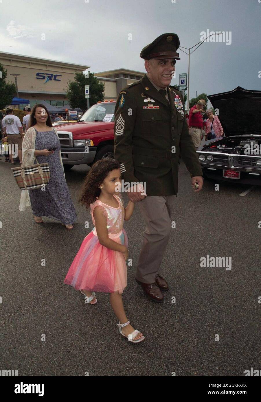 AMC's Command Sergeant Major Alberto Delgado and his wife listen as ...