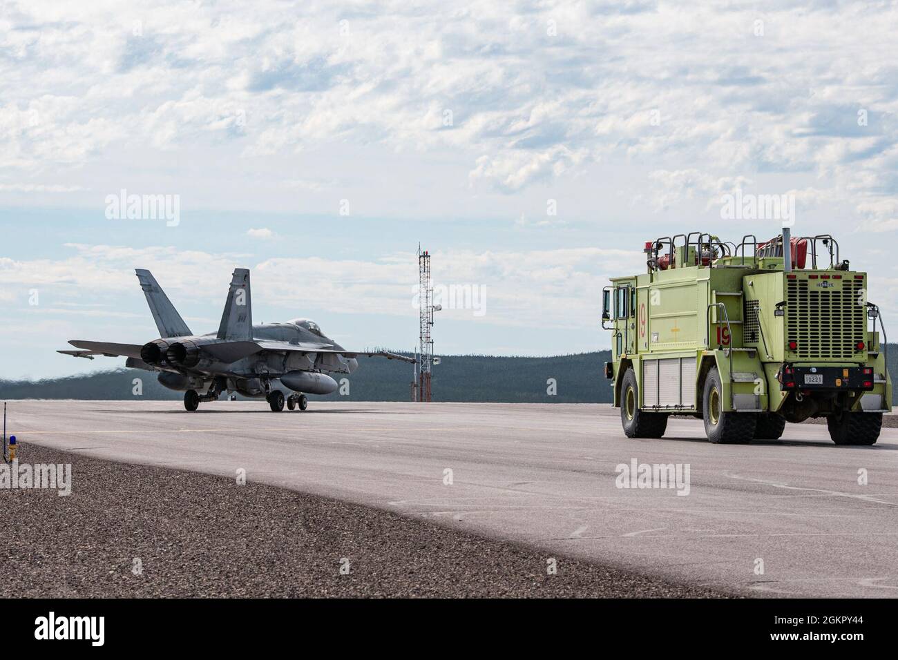 A Royal Canadian Air Force CF-18 Hornet taxis down the runway at Inuvik ...