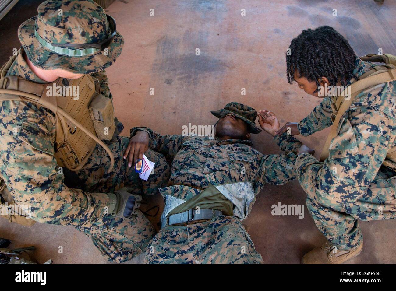 U.S. Navy Corpsman Hospitalman Third Class Jordan Ford, left, and ...