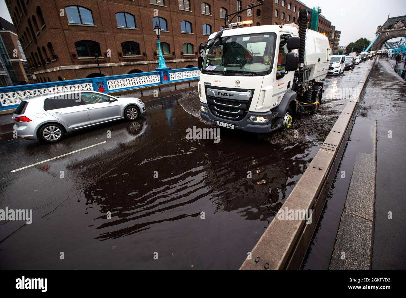 A maintenance vehicle uses a vacuum pump to suck up flood water on ...
