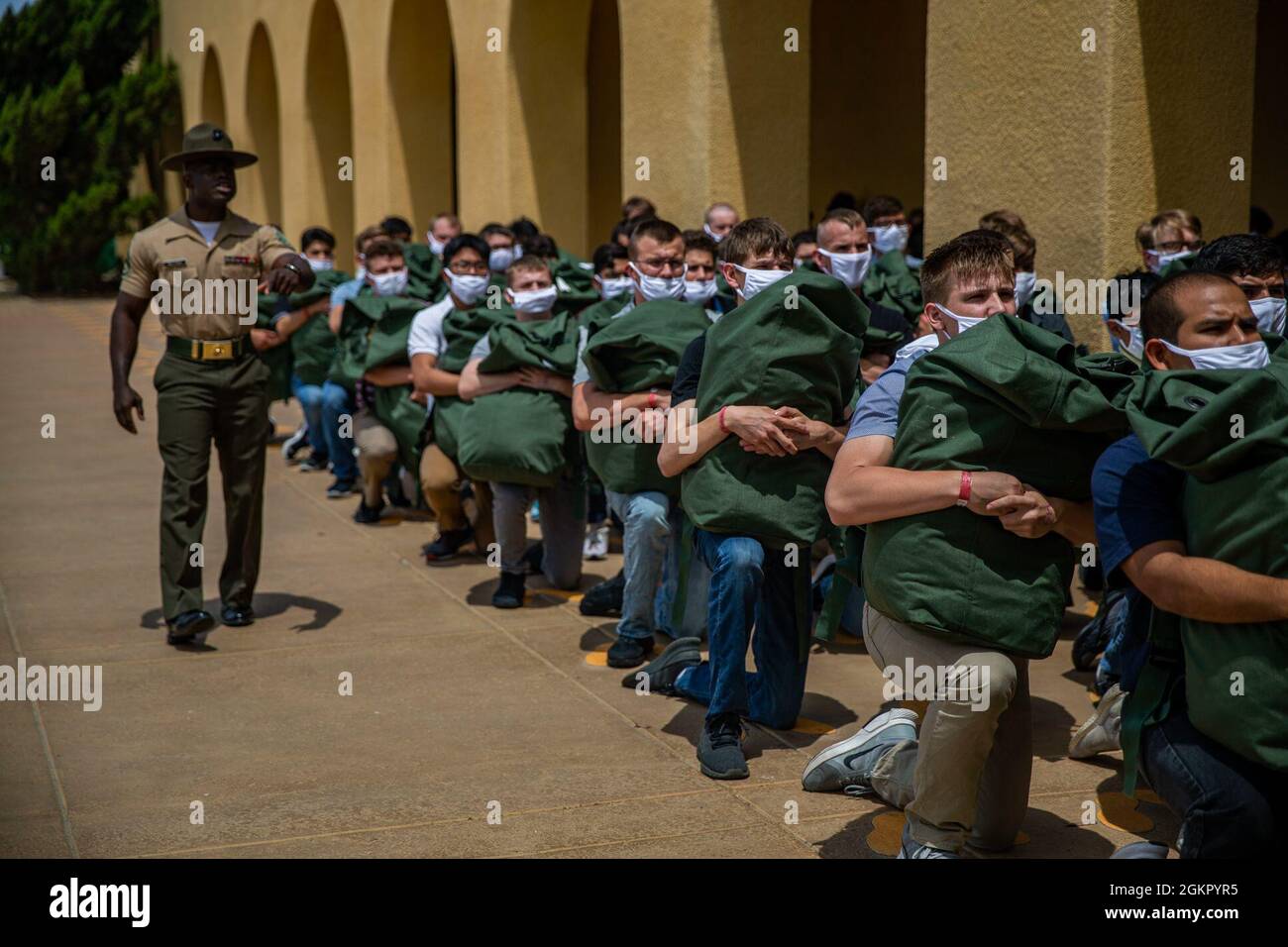 New recruits with Hotel Company, 2nd Recruit Training Battalion, kneel ...