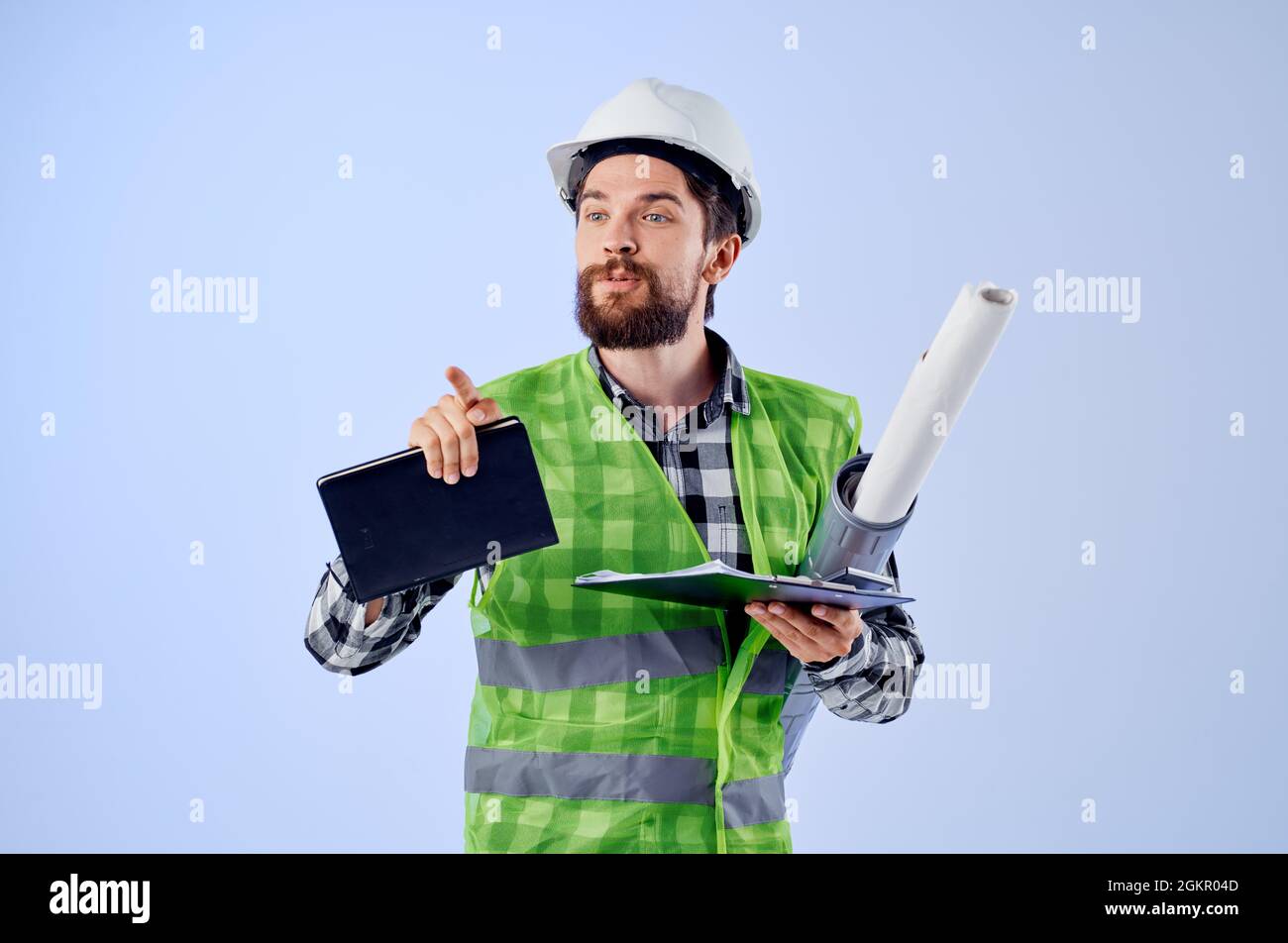 engineer with documents and drawings blueprints isolated background ...
