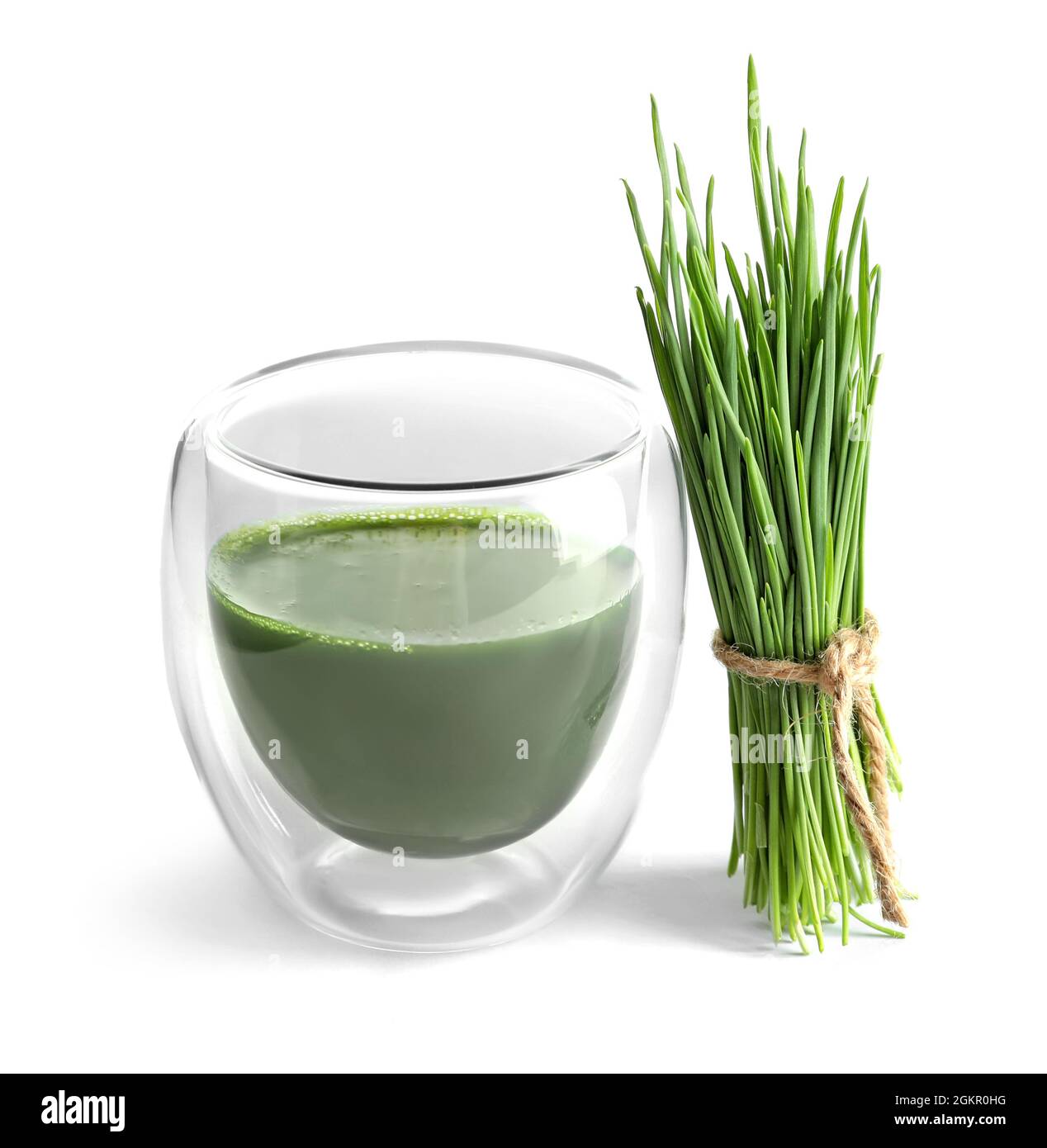 Shot of wheat grass drink on white background Stock Photo - Alamy